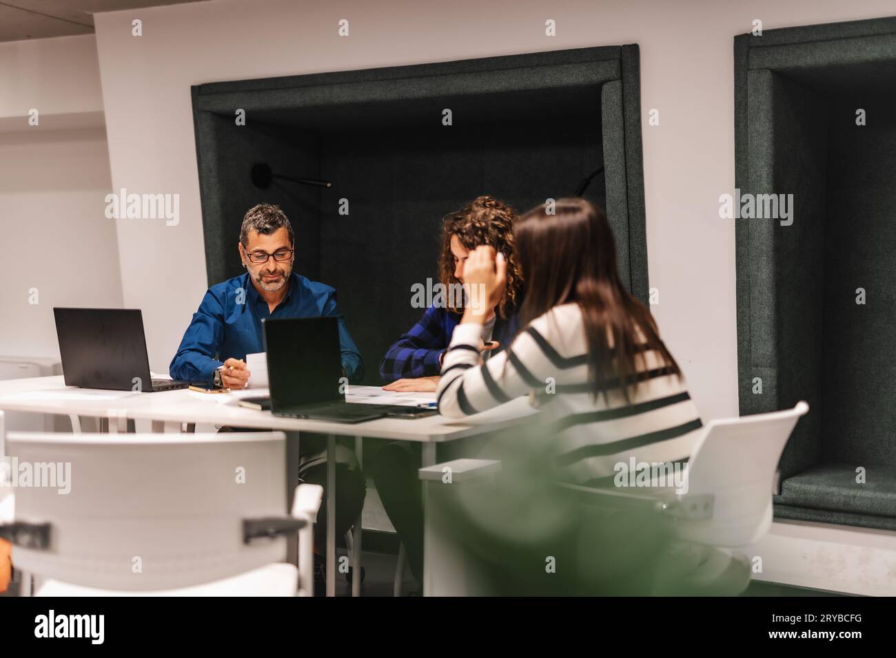 Good looking manager analyzing teamwork results. Businessman analyzing ...