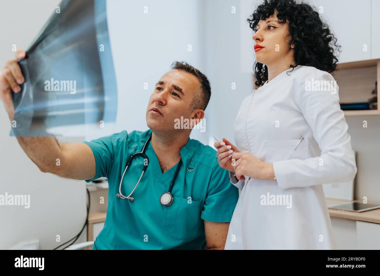 Doctor reviewing health test results hi-res stock photography and ...