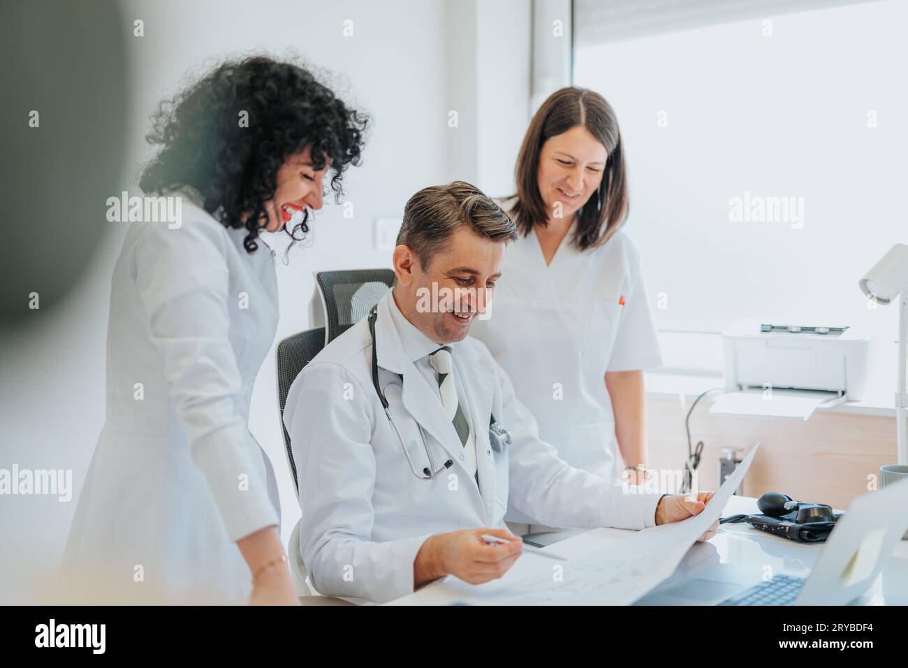 Expert Doctor Discussing Medical Test Results with Nurses Stock Photo ...