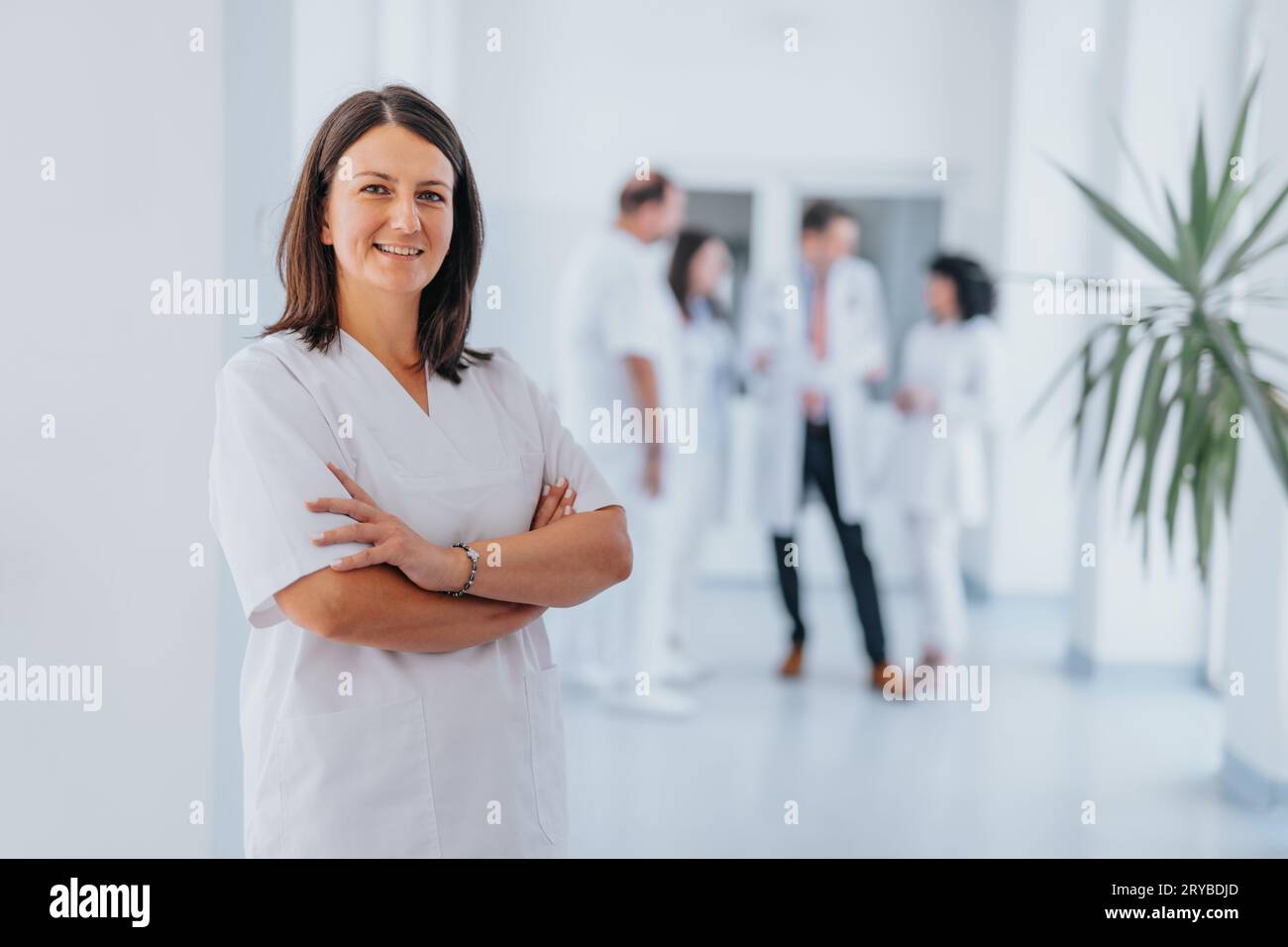 Confident female doctor poses hi-res stock photography and images - Alamy