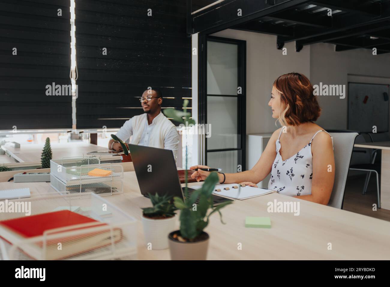 A diverse, efficient corporate team engaged in collaboration, innovation, and goal setting ...