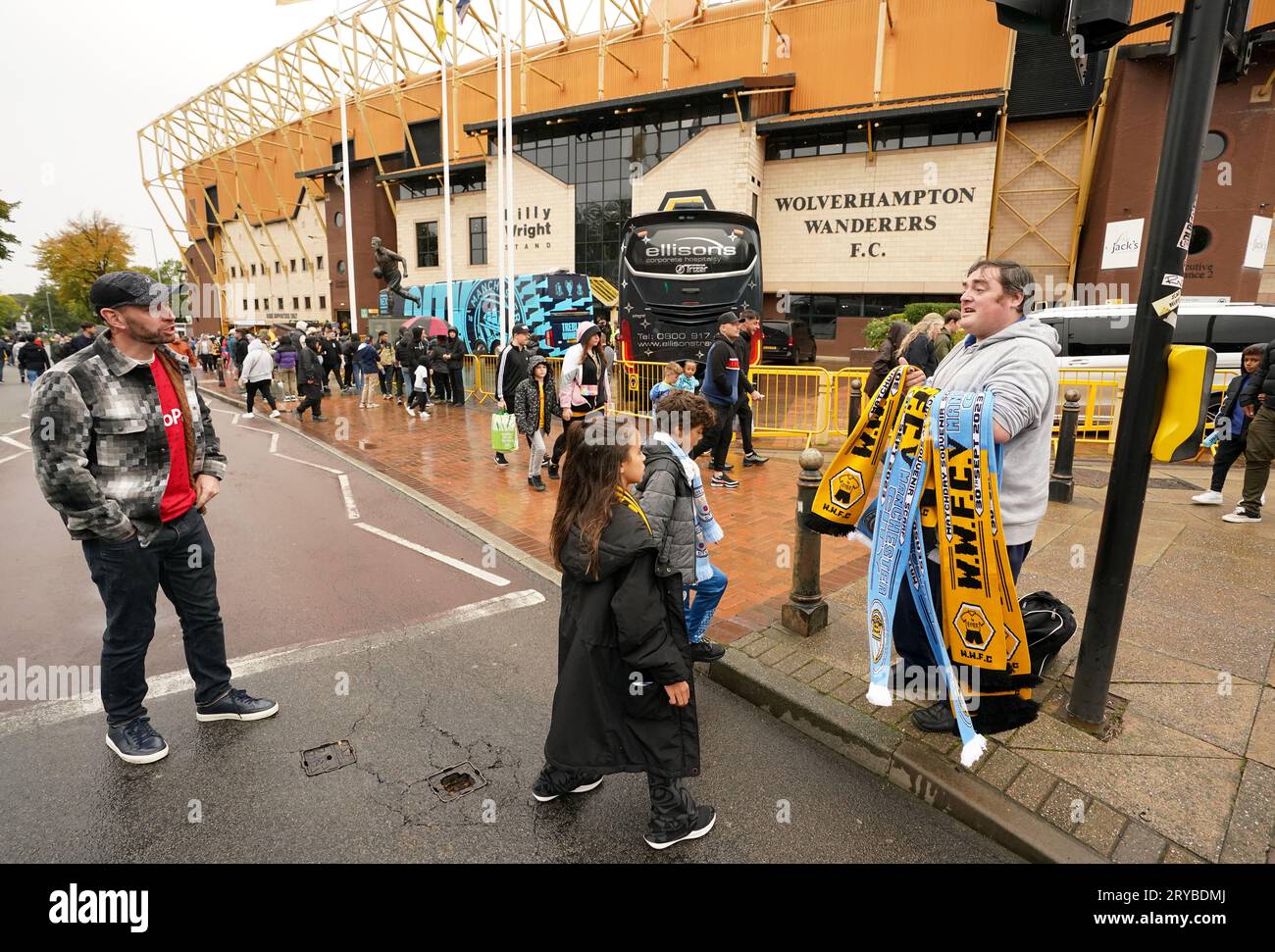 A vendor selling scarves outside the ground ahead of the Premier League ...