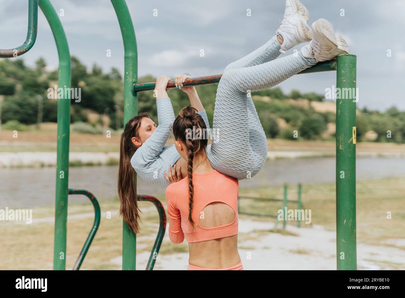 Active females exercising outdoors in a park. Inspiring workout program ...