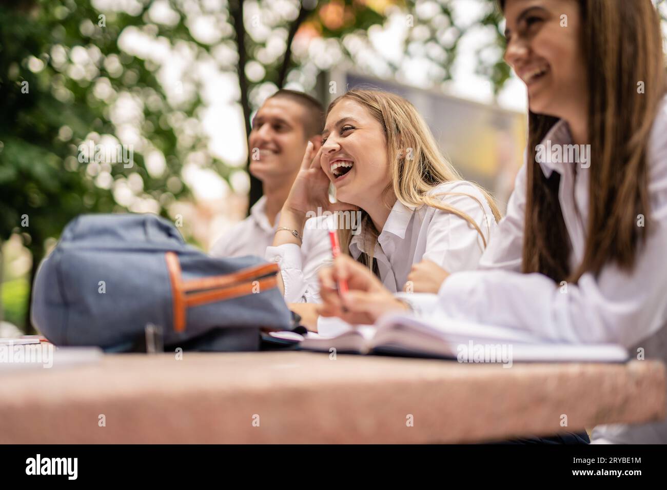 Happy students having fun and laughing after classes Stock Photo - Alamy