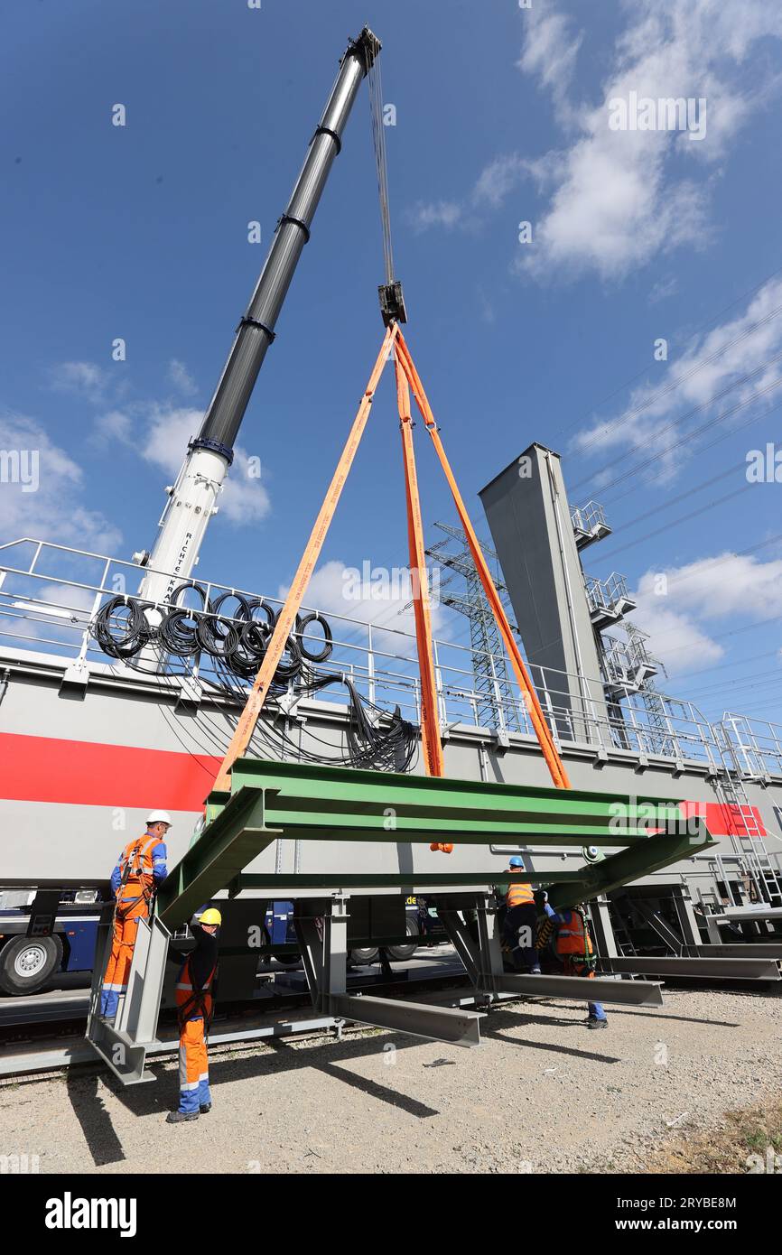Erfurt, Germany. 30th Sep, 2023. Workers from a crane company used a ...