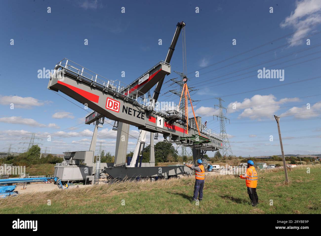 Erfurt, Germany. 30th Sep, 2023. Workers from a crane company used a ...