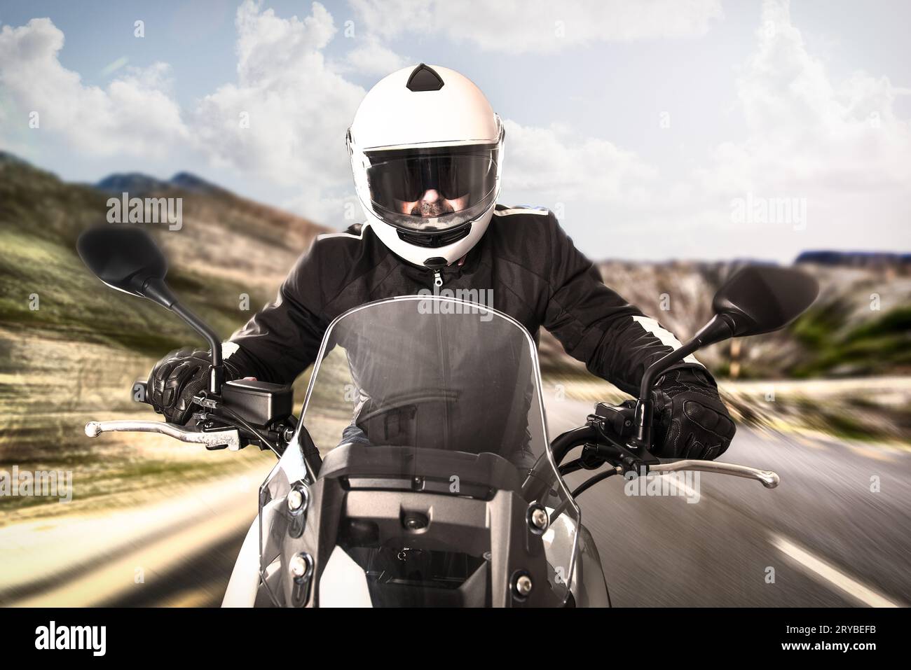Biker on the road Stock Photo - Alamy