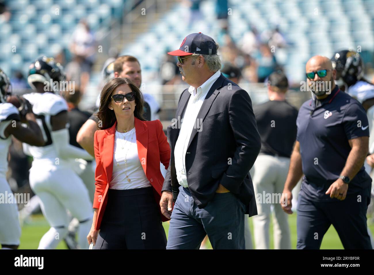 Houston Texans CEO Cal McNair, center, walks with his wife Hannah ... Houston Texans CEO Cal McNair, center, walks with his wife Hannah ...