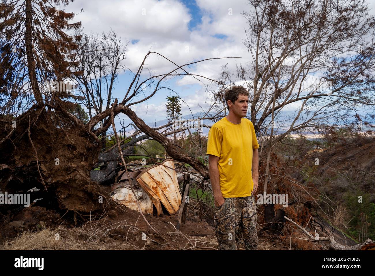 Kyle Ellison stands in front of a fallen tree on Wednesday, Sept. 27 ...