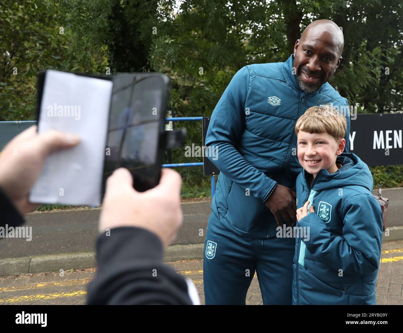 Huddersfield Town manager Darren Moore (left) poses for a photograph ...
