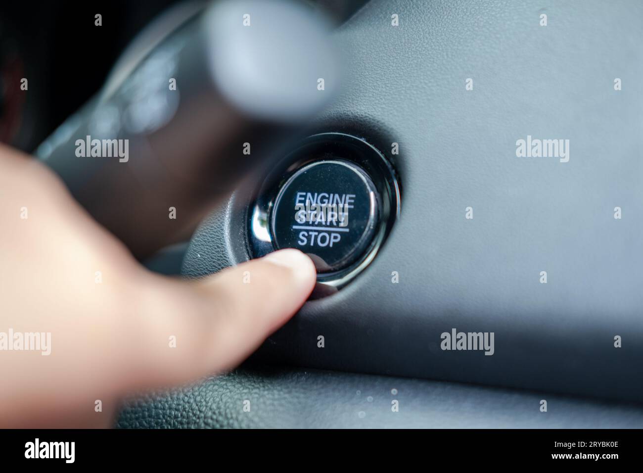 Male finger pressing engine start stop button Stock Photo - Alamy