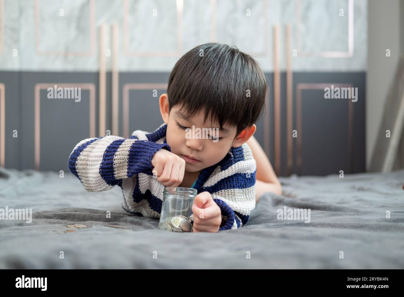 Boy counting coins hi-res stock photography and images - Alamy