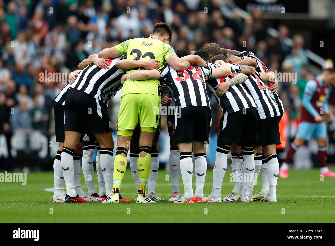 Newcastle United players form a huddle before the Premier League match ...