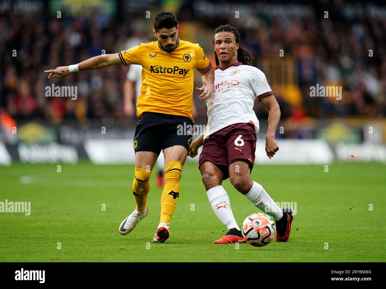 Wolverhampton Wanderers' Pedro Neto (left) and Manchester City's Nathan ...