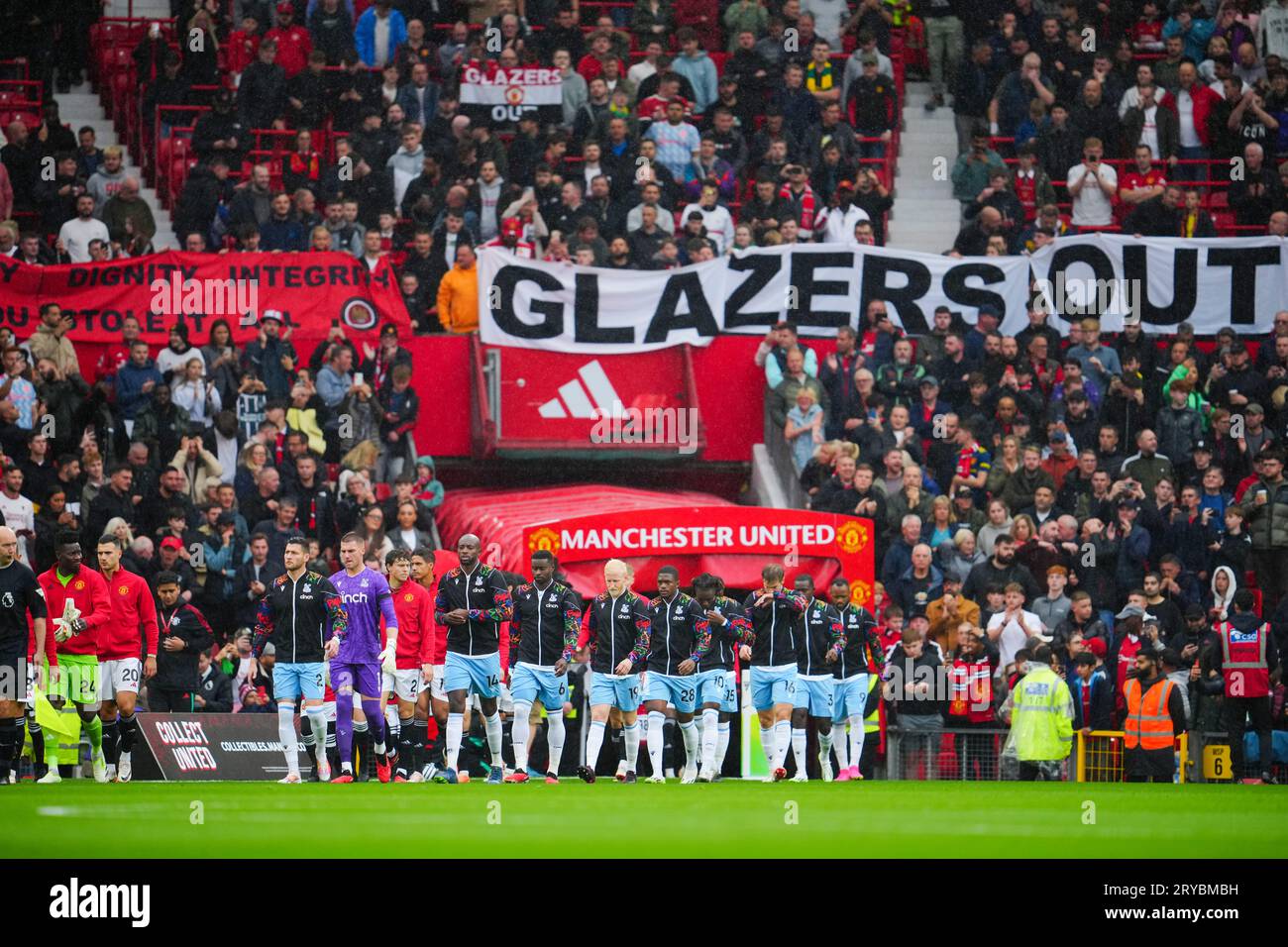 Manchester United fans hold up banners against the current owners of ...