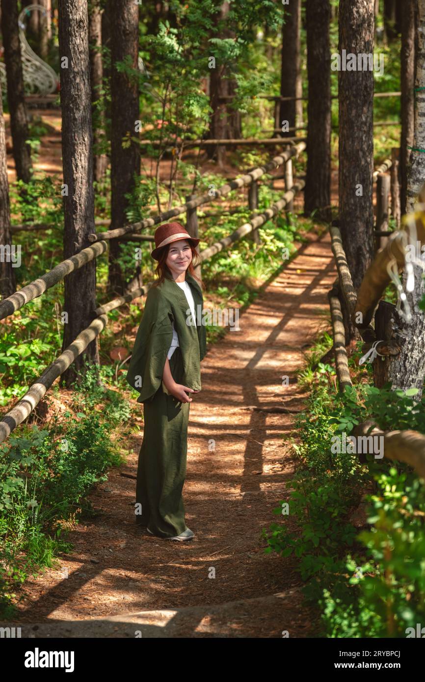 Cute teenage girl walking along a beautiful path in the forest Stock ...