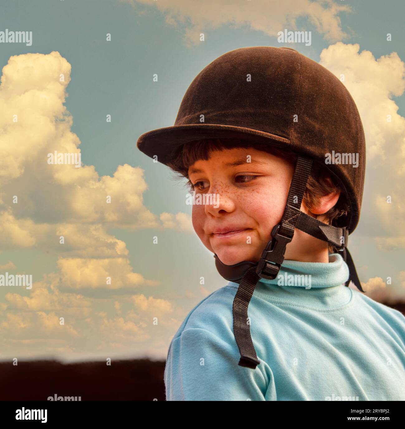 portrait of a girl with a riders hat mounted on a horse, taking riding ...