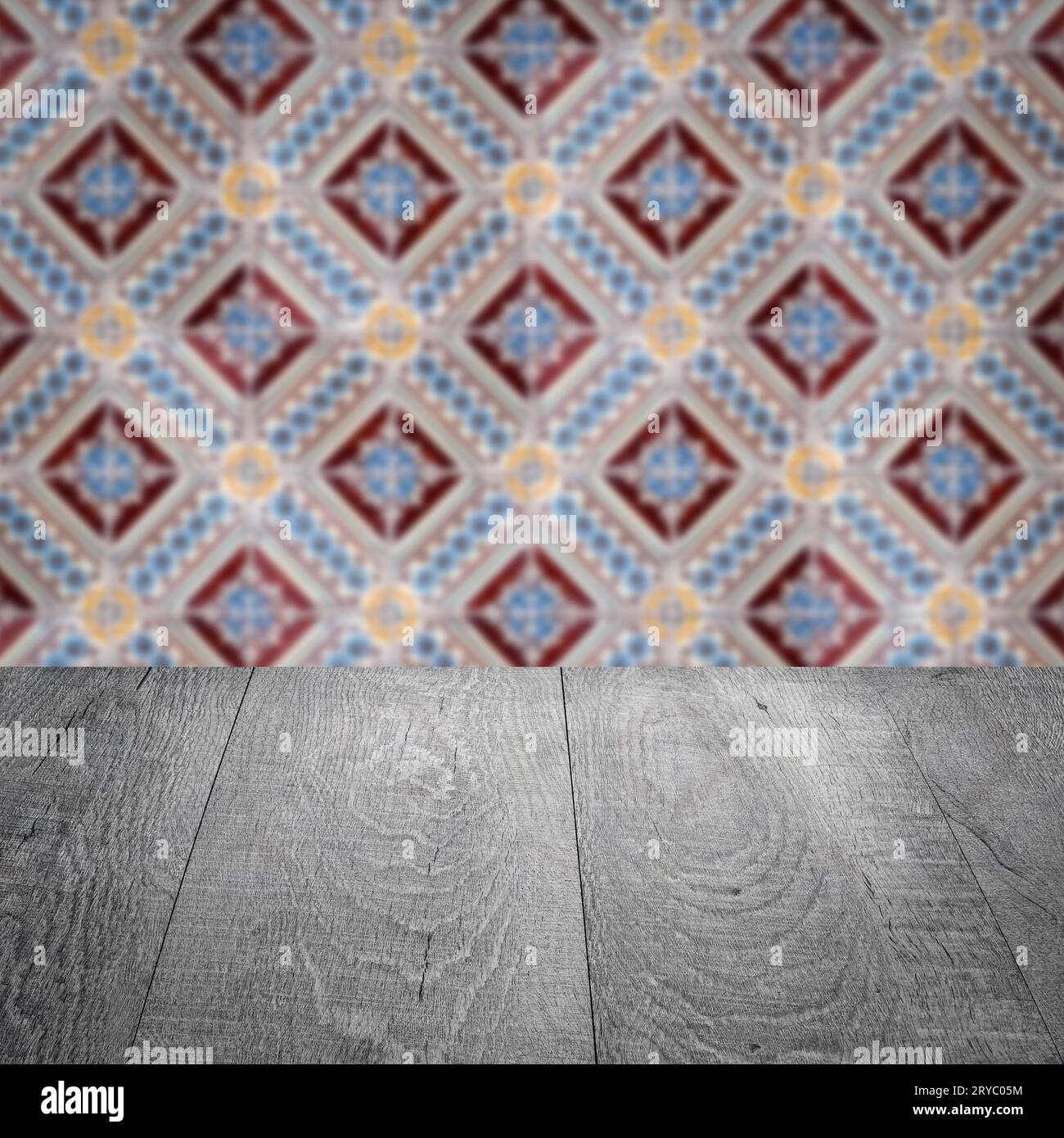 Wood table top and blur vintage ceramic tile pattern wall Stock Photo ...