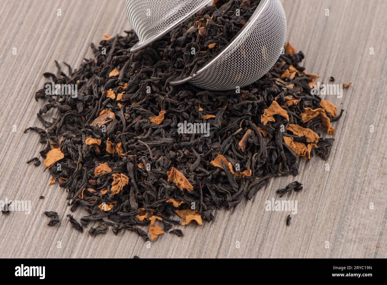 Black dry tea with petals Stock Photo - Alamy