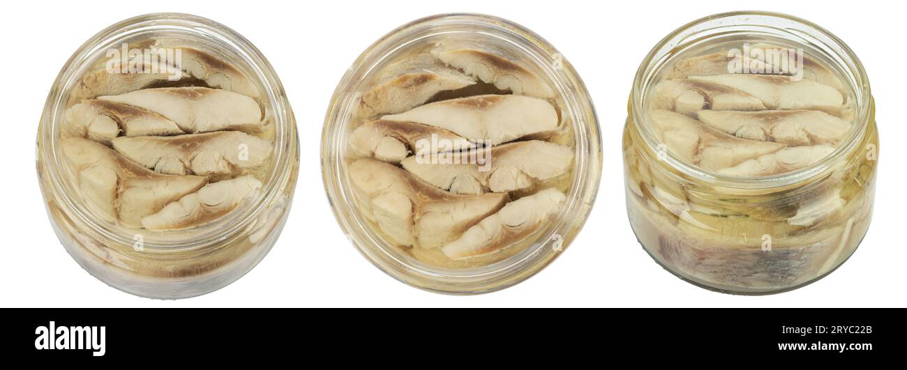 Sliced salted and pickled herring fish in jar isolated on white ...