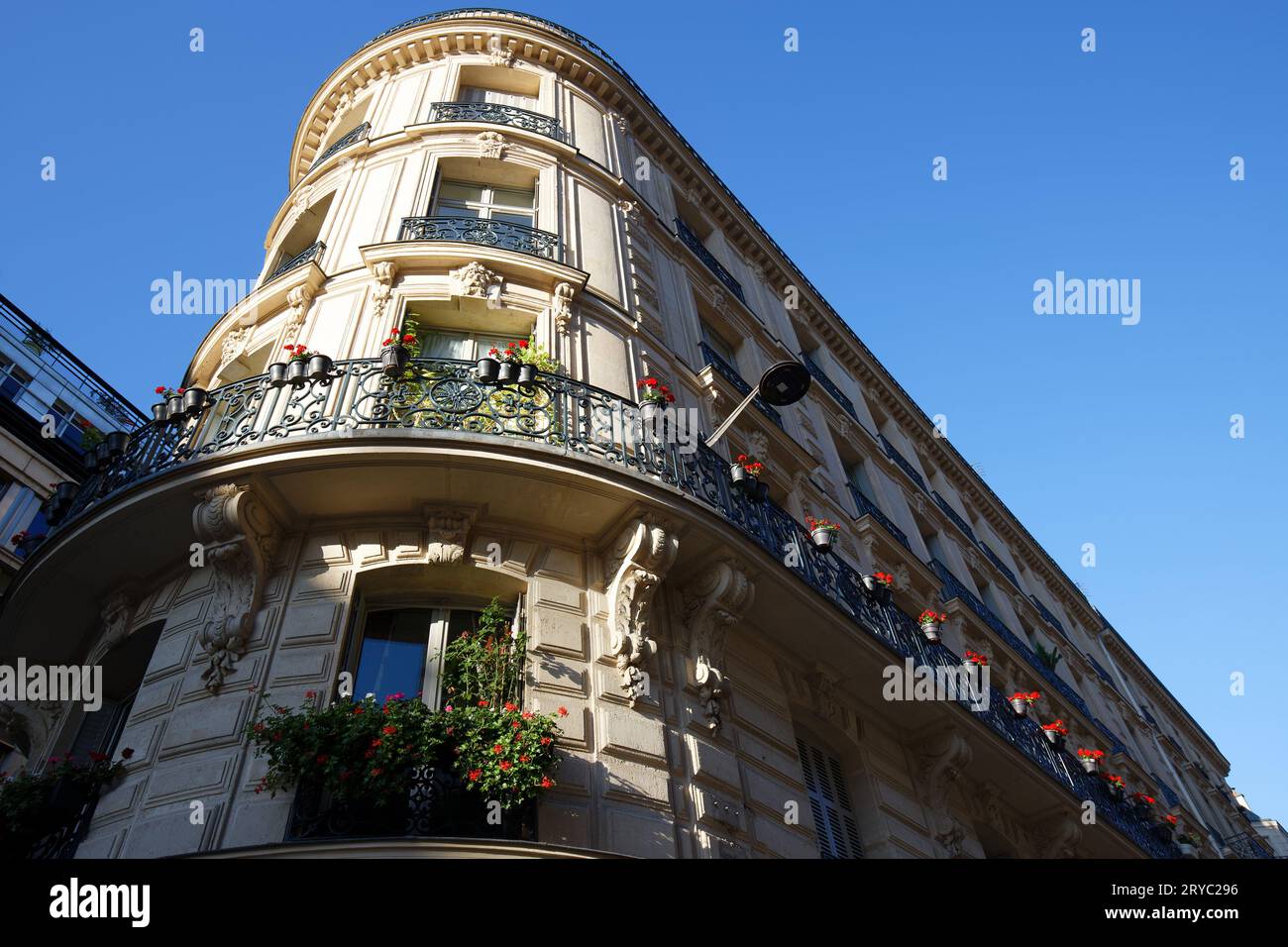 The facade of traditional French house with typical balconies and ...