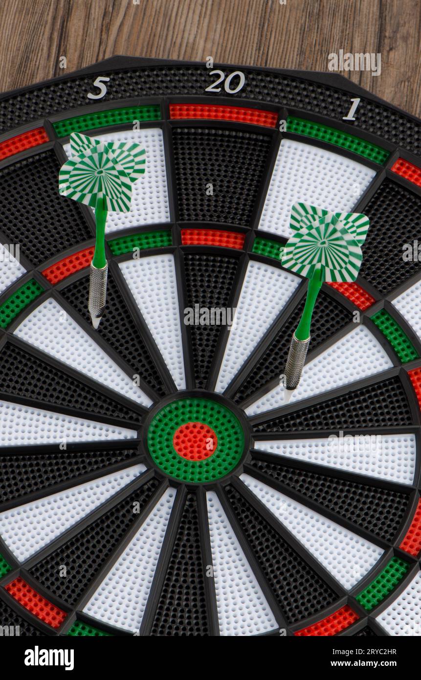 Dart board with darts Stock Photo - Alamy