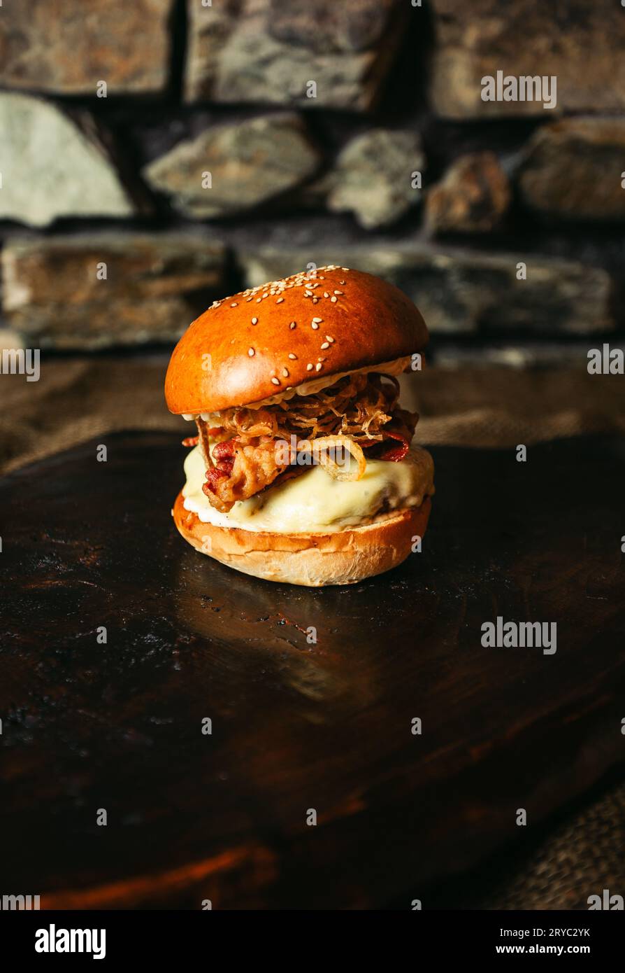 Illuminated photo of american hamburger with chuck roll meat, cheddar ...