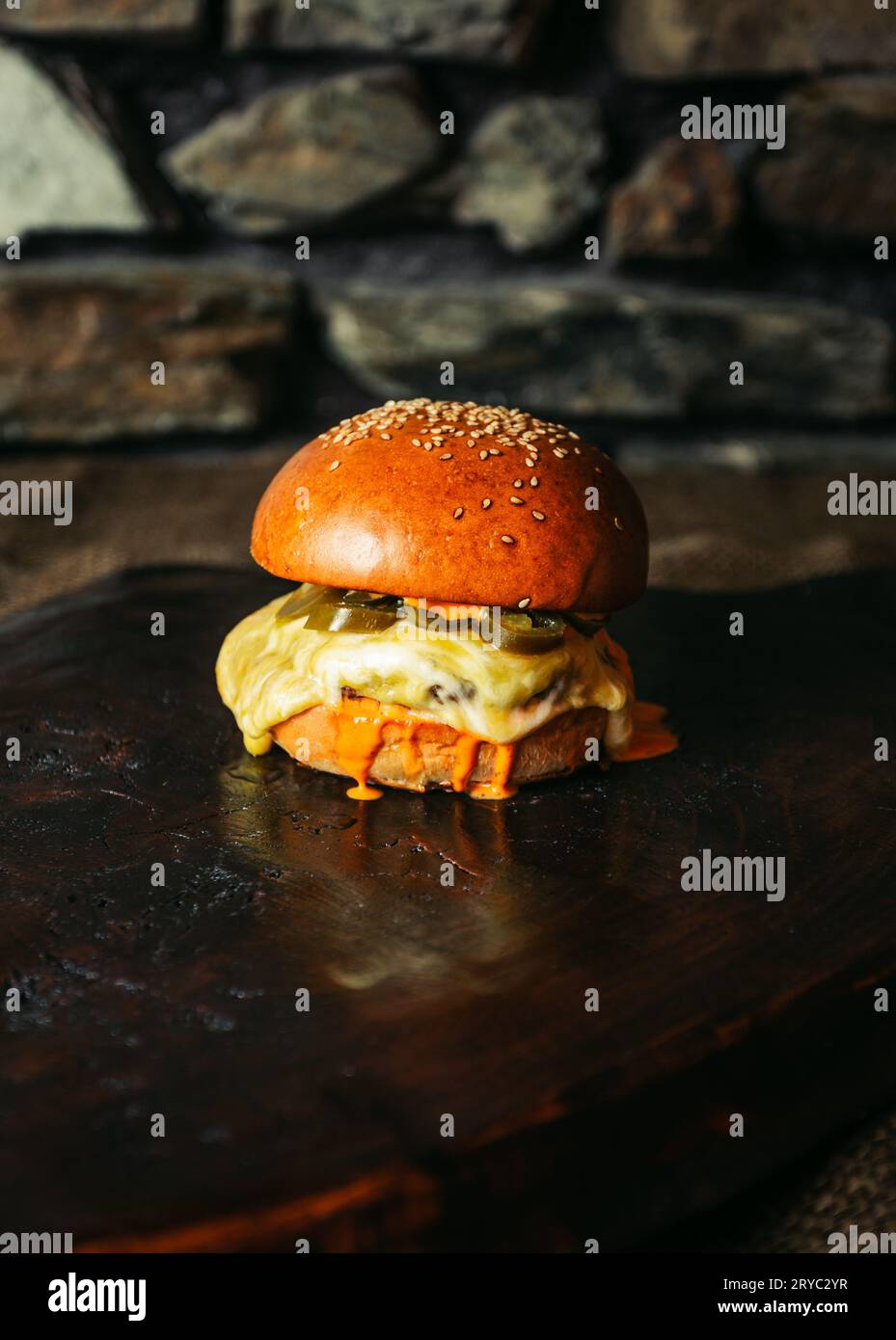 Illuminated photo of american hamburger with chuck roll meat, cheddar ...