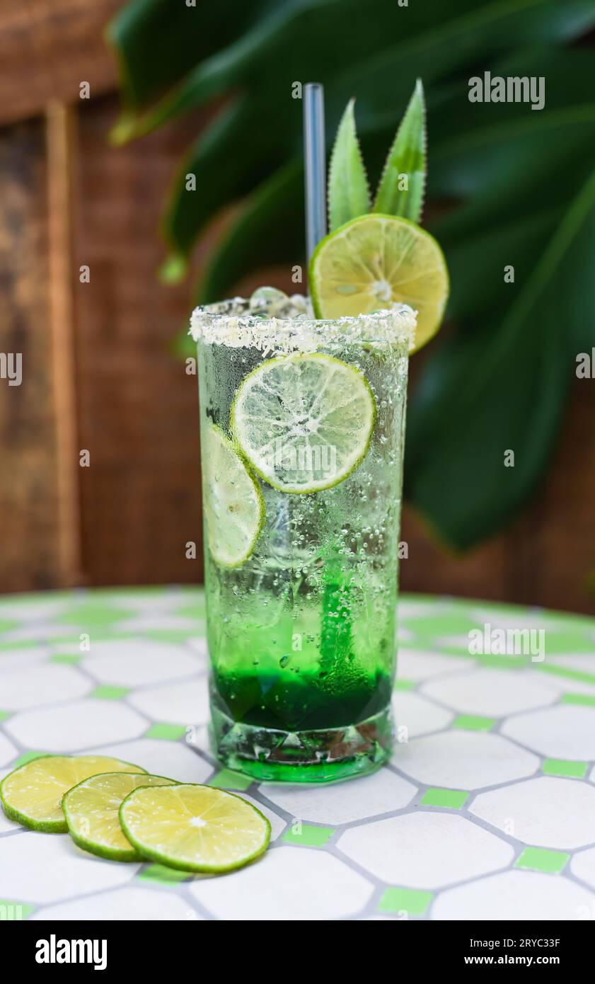 Panda leaves lemonade with desiccated coconut and green syrup on light ...