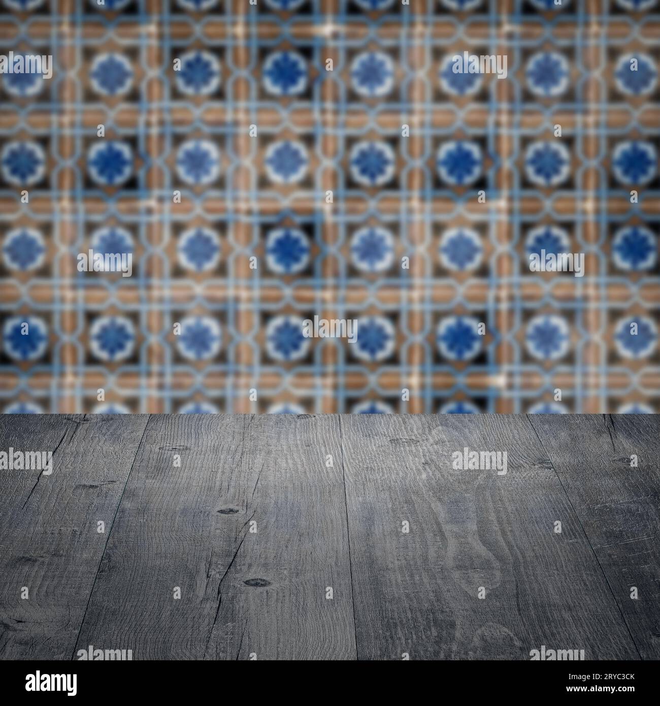 Wood table top and blur vintage ceramic tile pattern wall Stock Photo ...