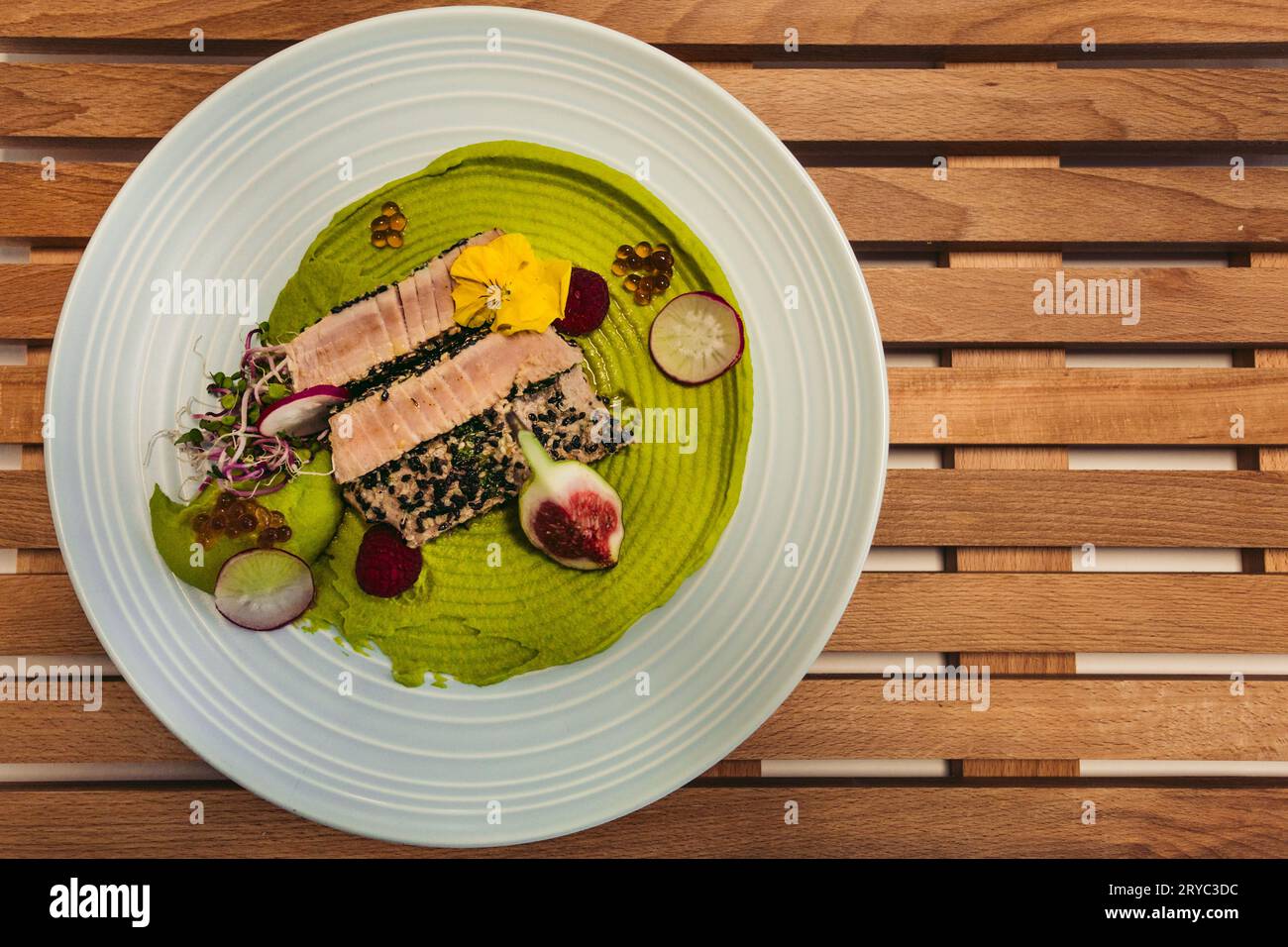 Roasted Tuna fish on spinach cream with fresh fruits and vegetables ...