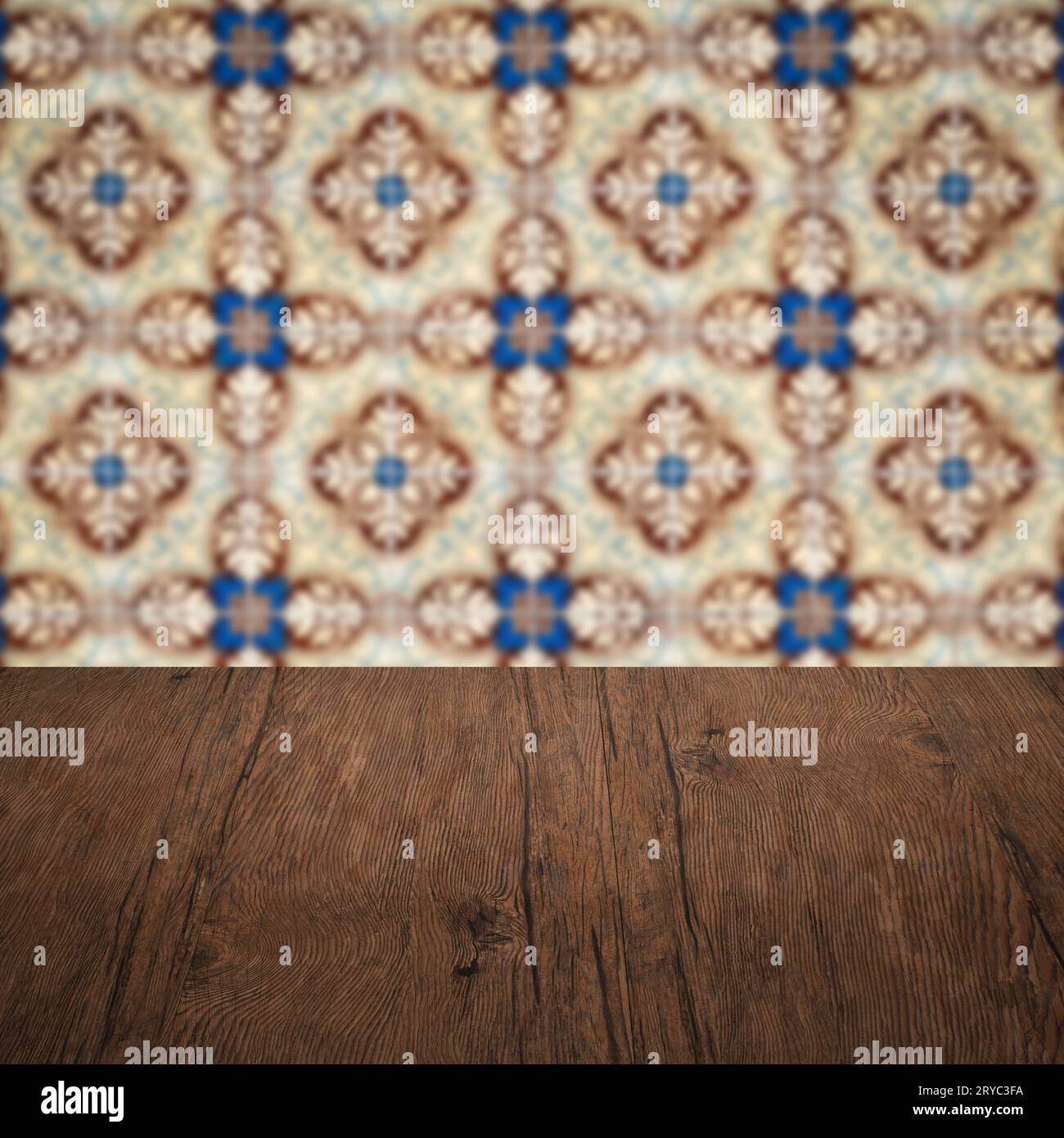 Wood table top and blur vintage ceramic tile pattern wall Stock Photo ...