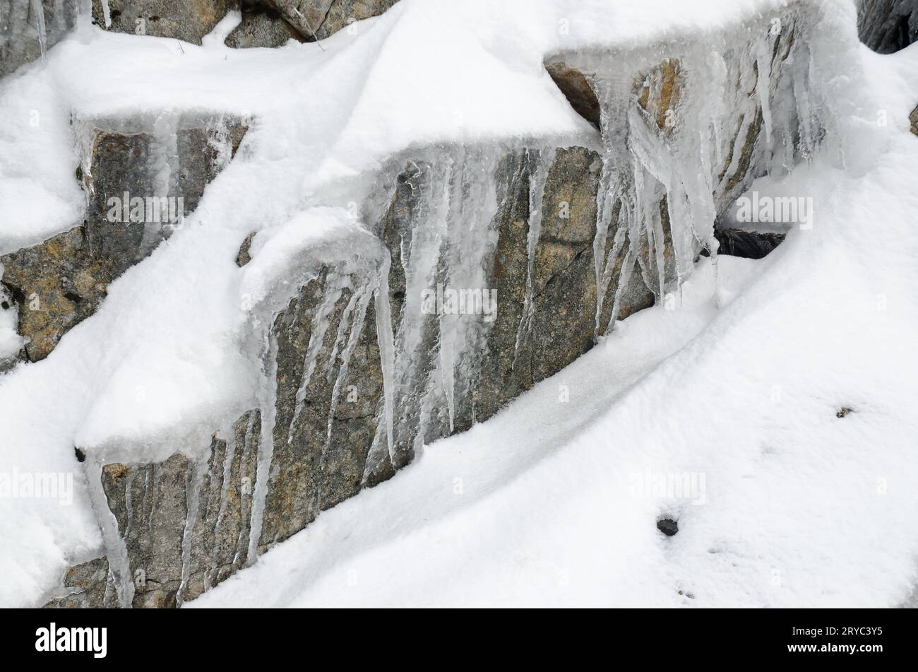 Snow on rock Stock Photo - Alamy