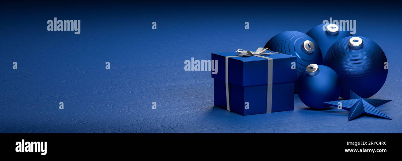 Classic blue Christmas Baubles and a gift box and star on a blue stone ...