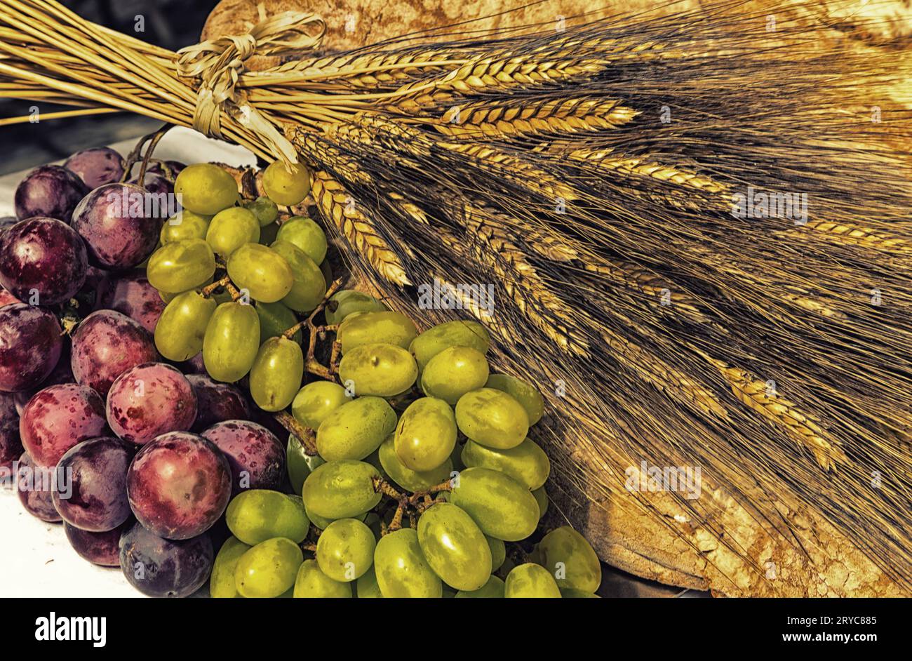 Bread, grapes and wheat as a symbol of Christian Communion Stock Photo ...