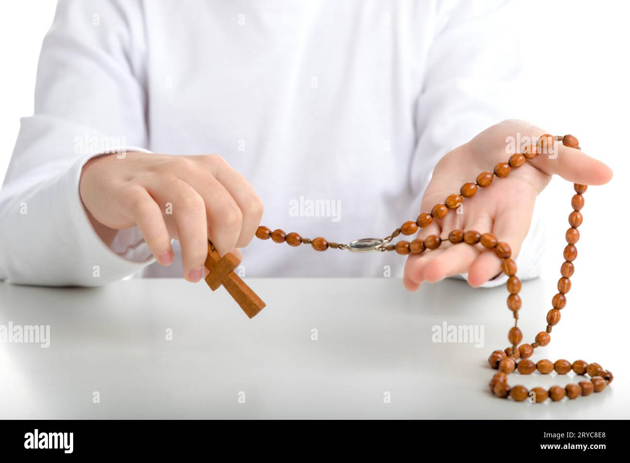 Praying hands holding rosary beads hi-res stock photography and images ...