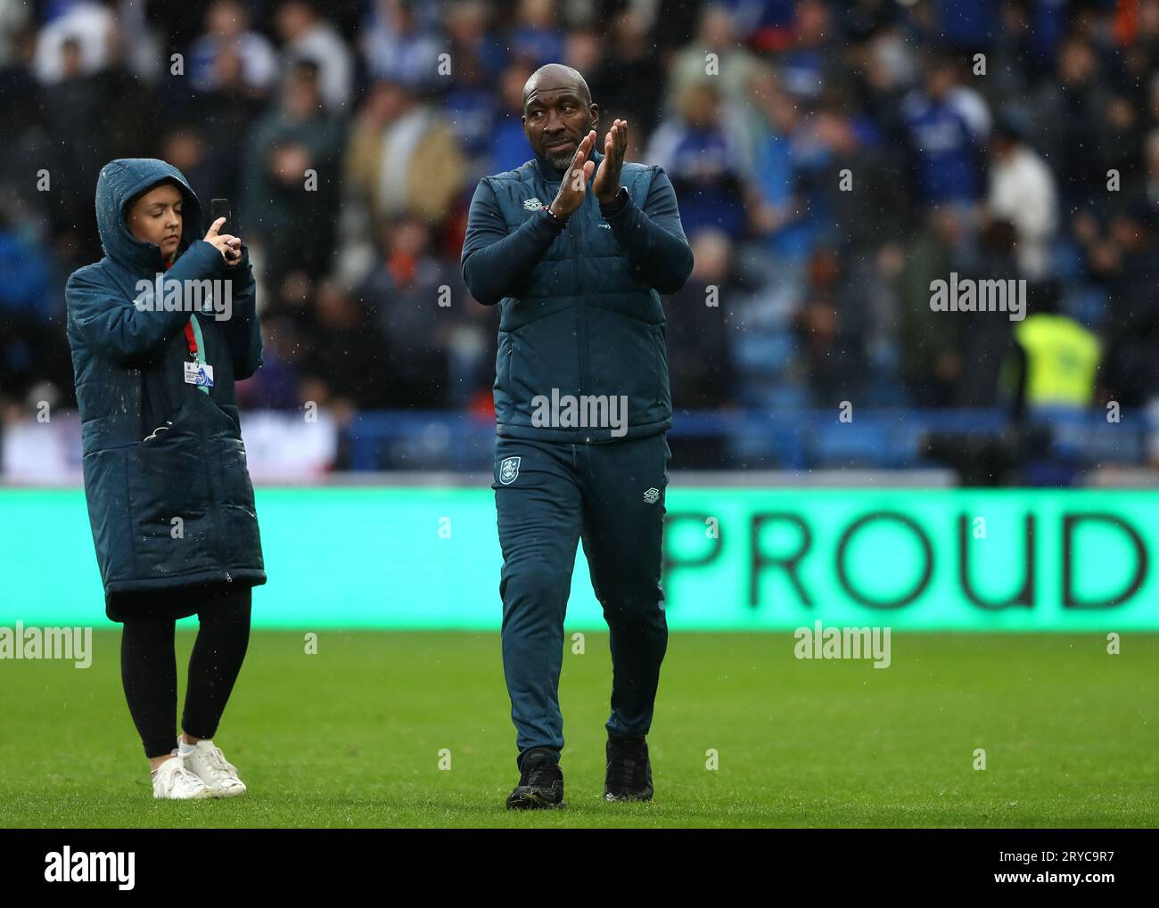Huddersfield Town manager Darren Moore applauds the fans following the ...