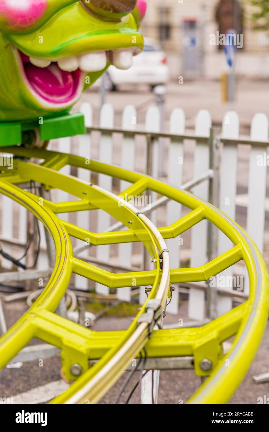 Roller coaster with caterpillar-shaped train Stock Photo - Alamy