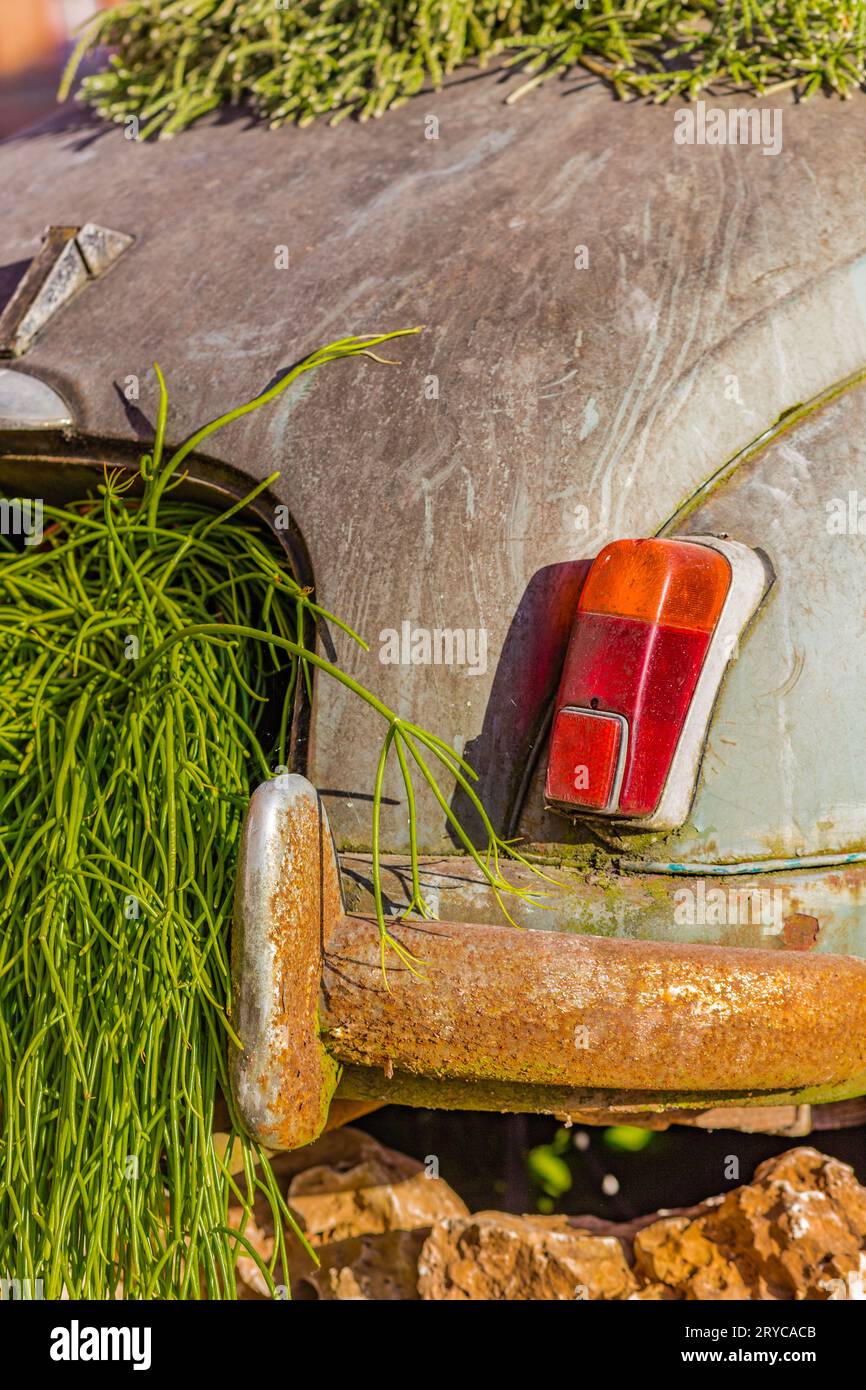 Carcass of an old rusty car in the desert Stock Photo - Alamy