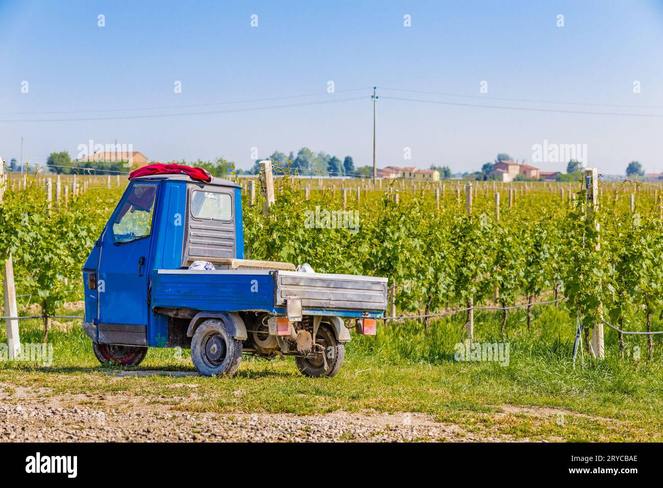 Three wheels van in the countryside Stock Photo - Alamy
