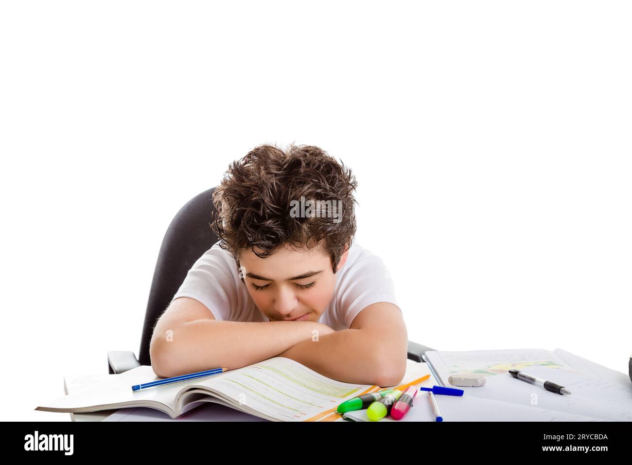 Tired boy doing homework Stock Photo - Alamy
