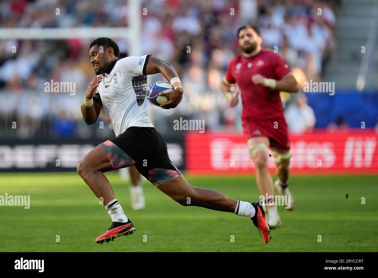 Fiji's Ilaisa Droasese runs with the ball during the Rugby World Cup ...