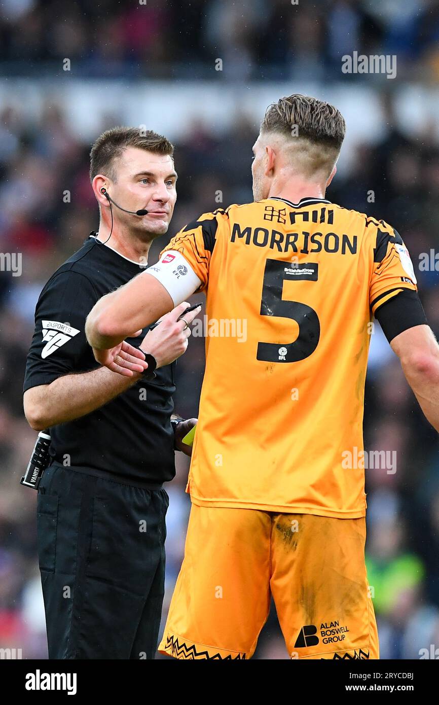 Referee, Ollie Yates has words with Michael Morrison of Cambridge ...