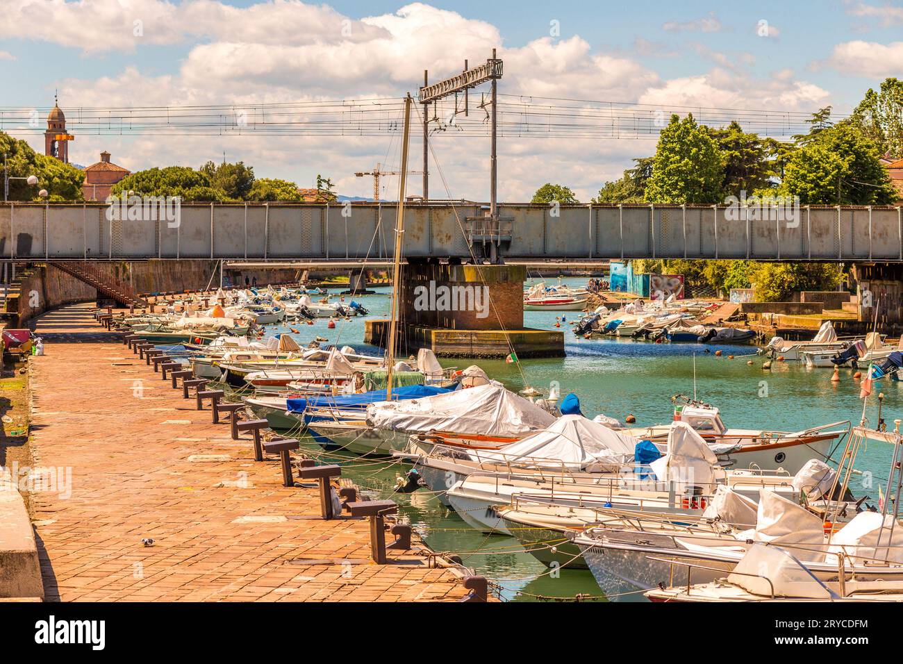 Boats moored in harbor channel Stock Photo - Alamy