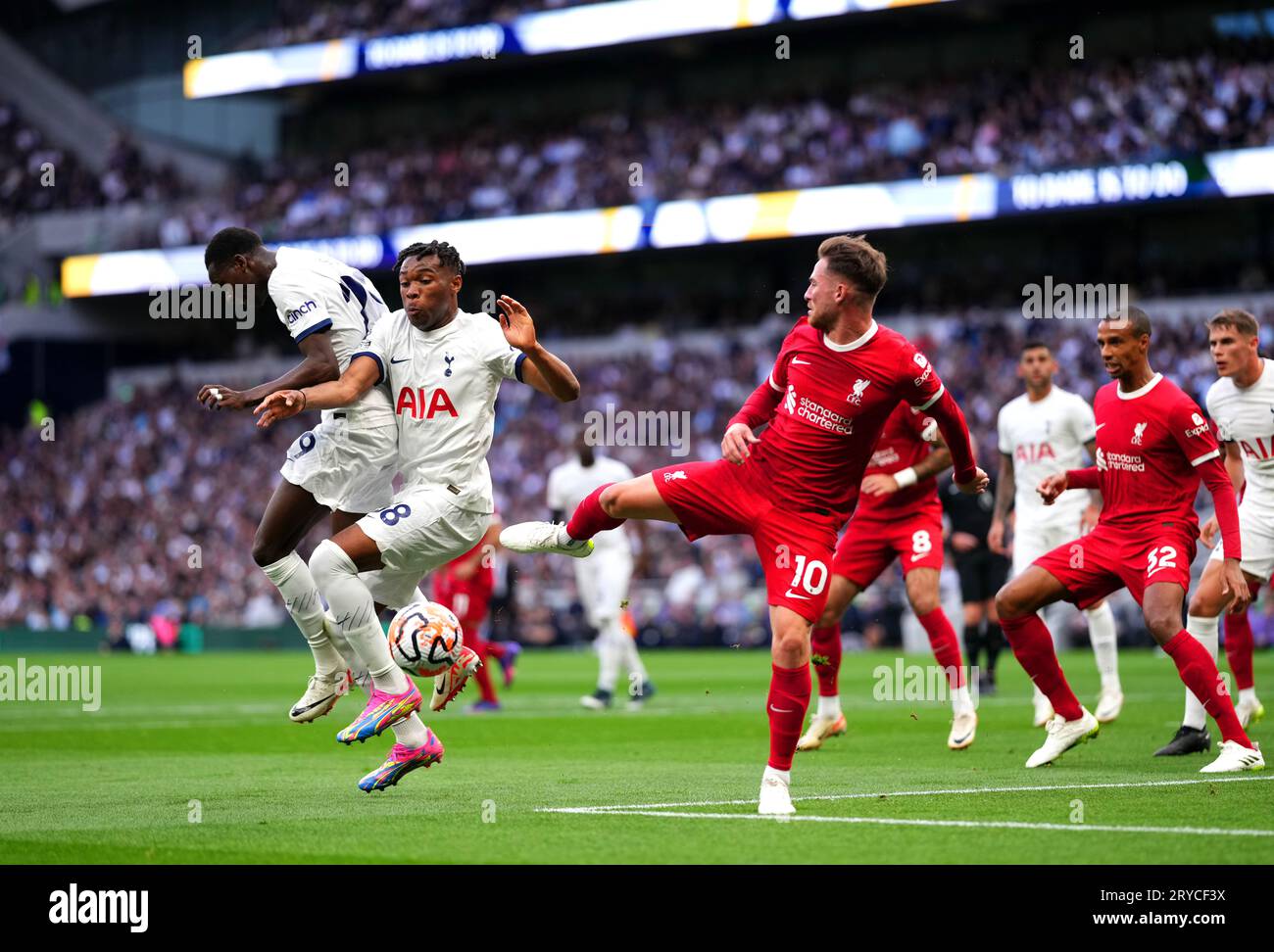Liverpool's Alexis Mac Allister (right) battles for the ball with ...