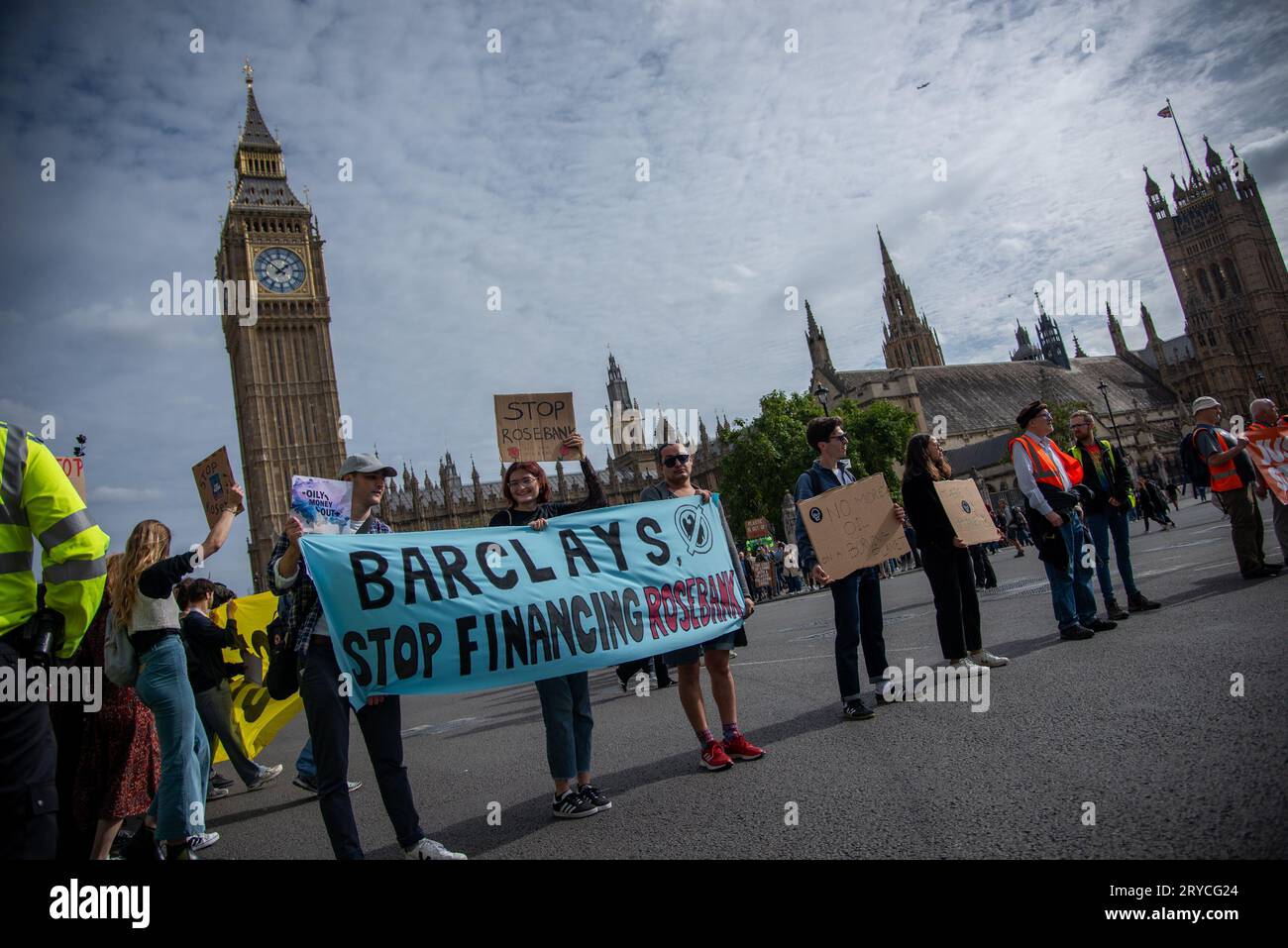 London, UK. 30th Sep, 2023. Protestors march with a large banner during ...