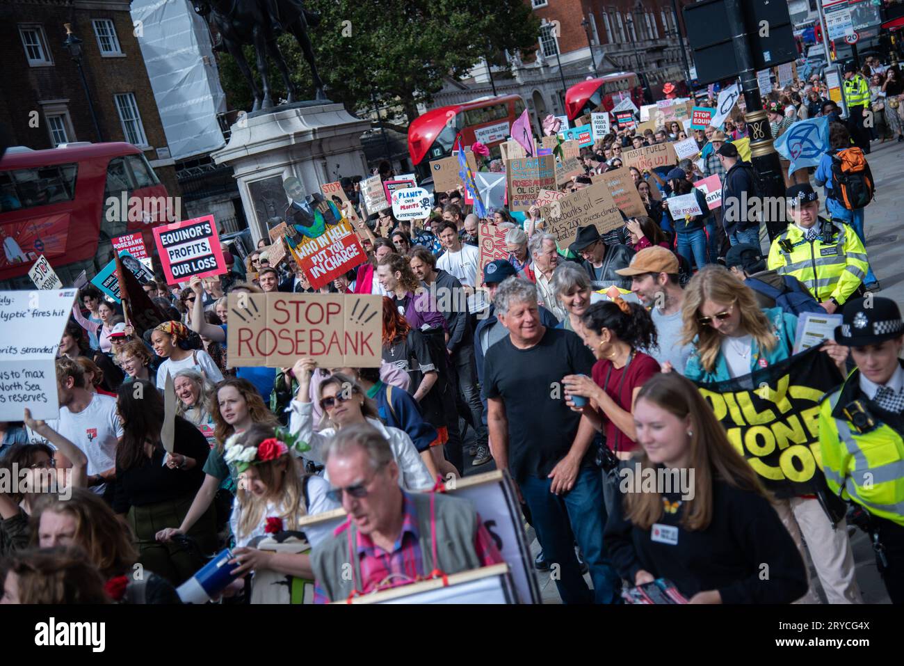 London, UK. 30th Sep, 2023. A crowd of protestors march with placards ...