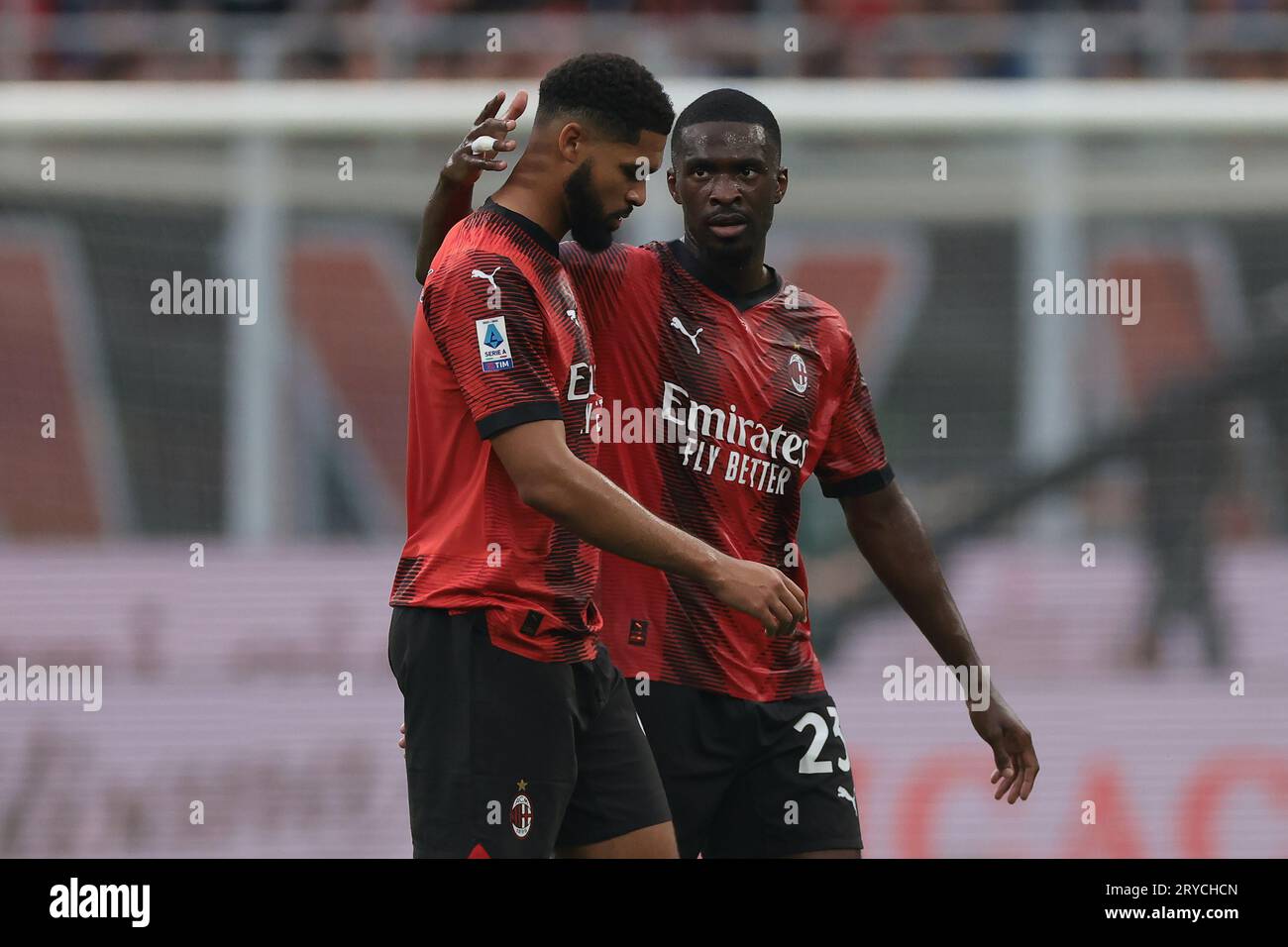 Milan, Italy. 30th Sep, 2023. Fikayo Tomori of AC Milan gives a pat on ...