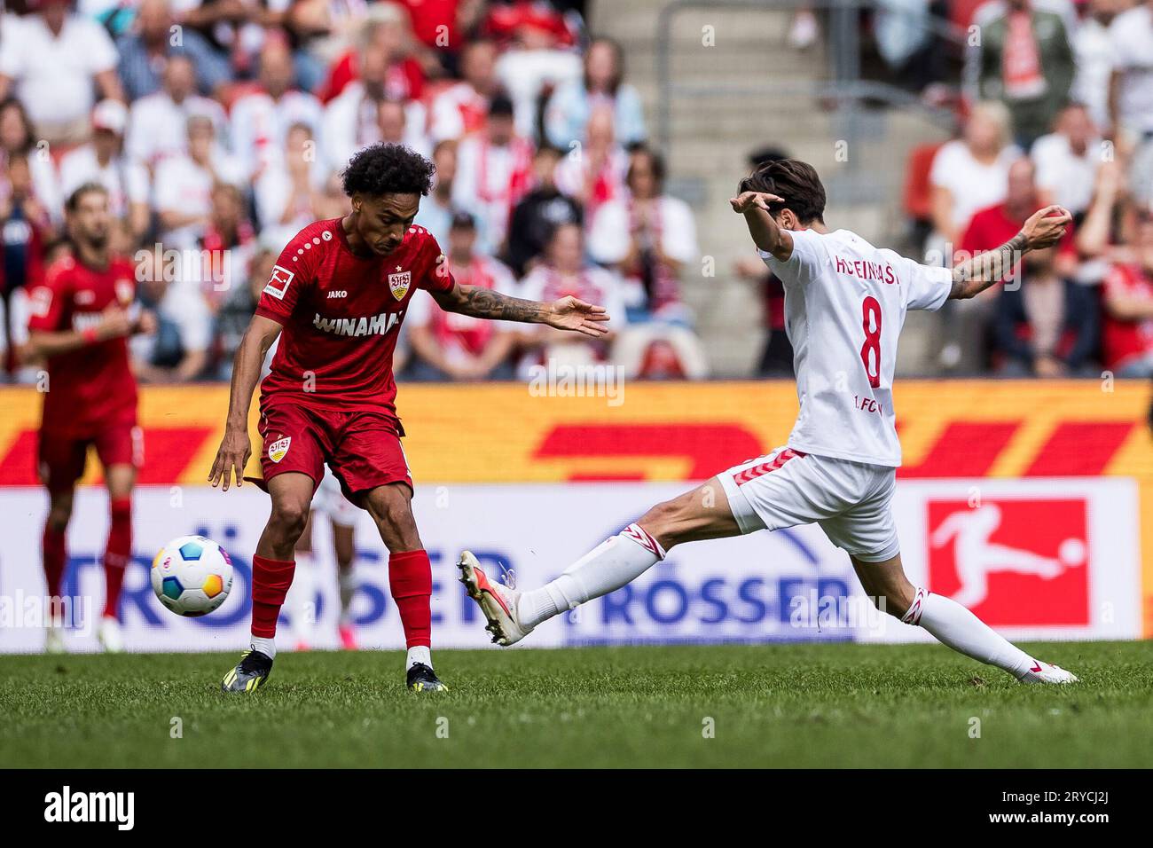Koeln, Deutschland. 30th Sep, 2023. Zweikampf Enzo Millot (VfB Stuttgart, #8), Denis Huseinbasic ...