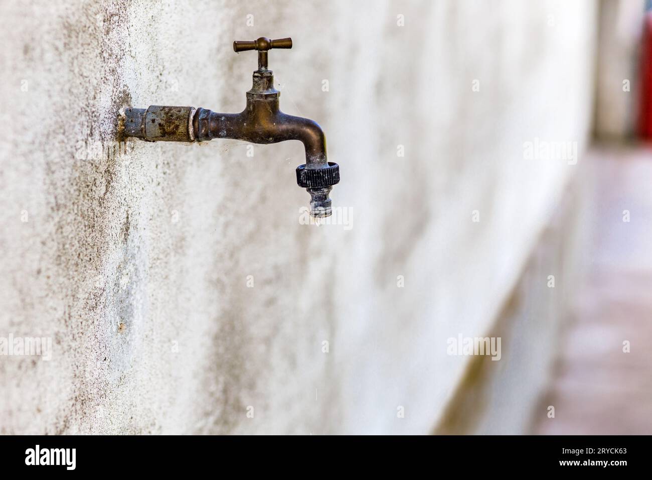 Old rusty faucet leaks Stock Photo - Alamy